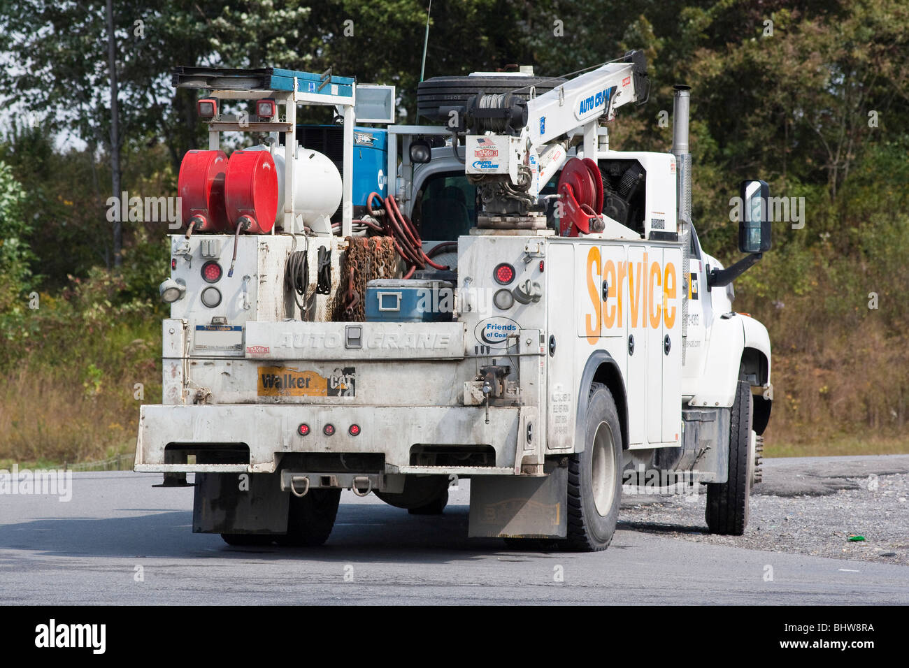 Supply truck with crane Caterpillar equipment loaded service truck ...