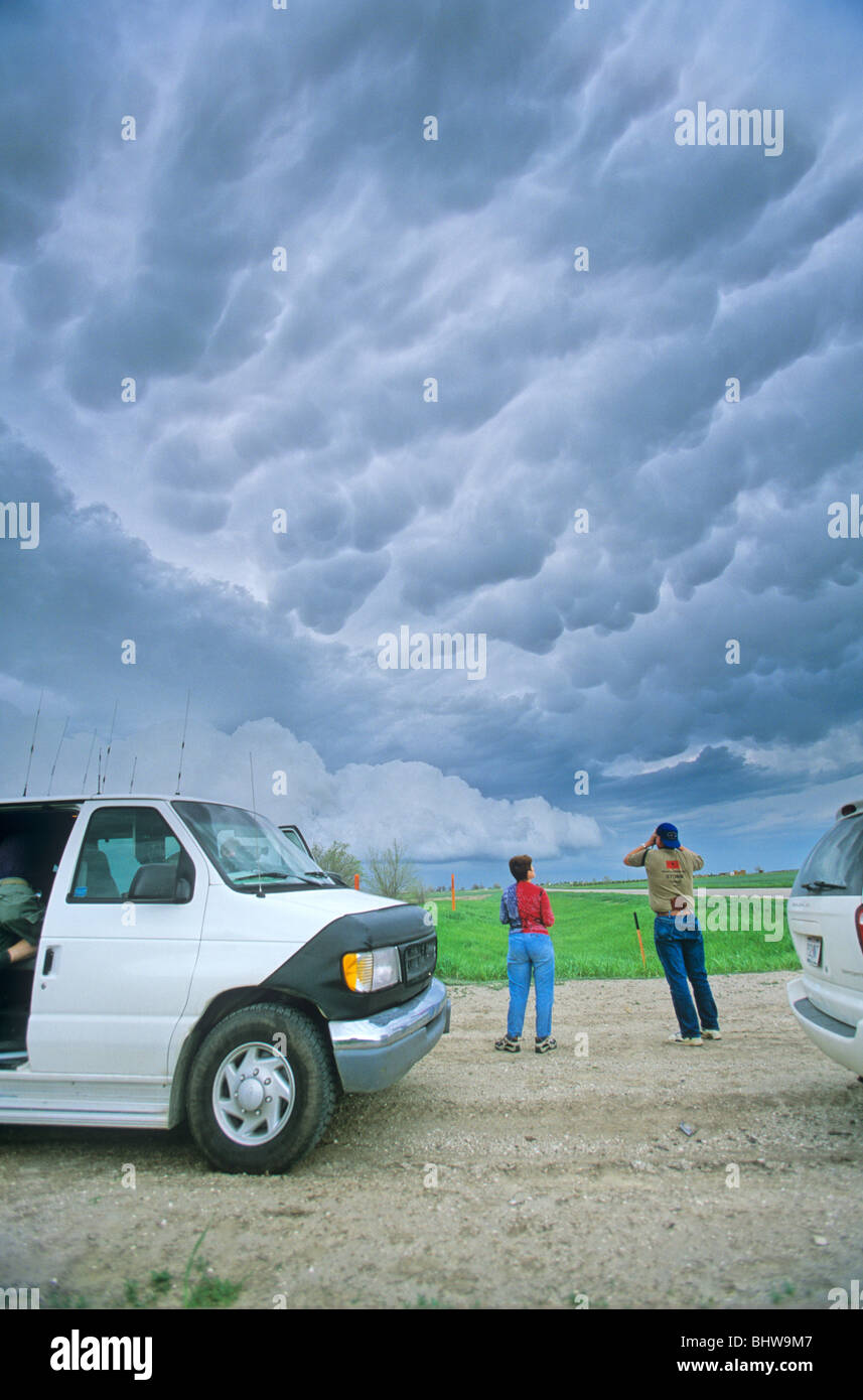 Storm chasers viewing stormy sky in Tornado Alley region of Great ...