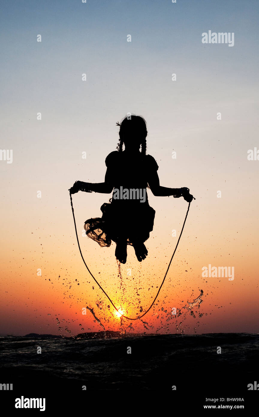Children jumping into water silhouette hi-res stock photography and ...