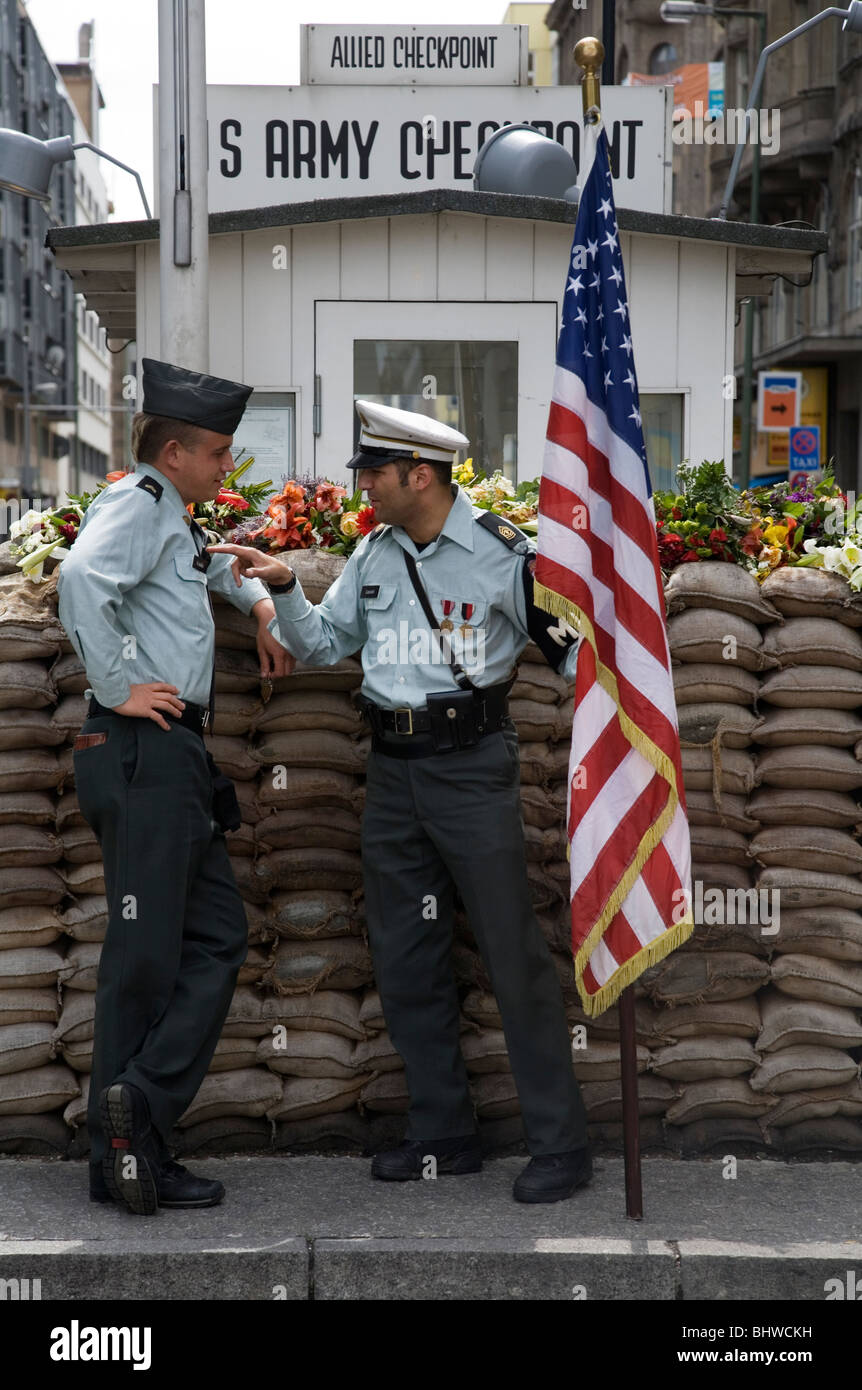 Two american soldiers with an american flag standing guard at ...
