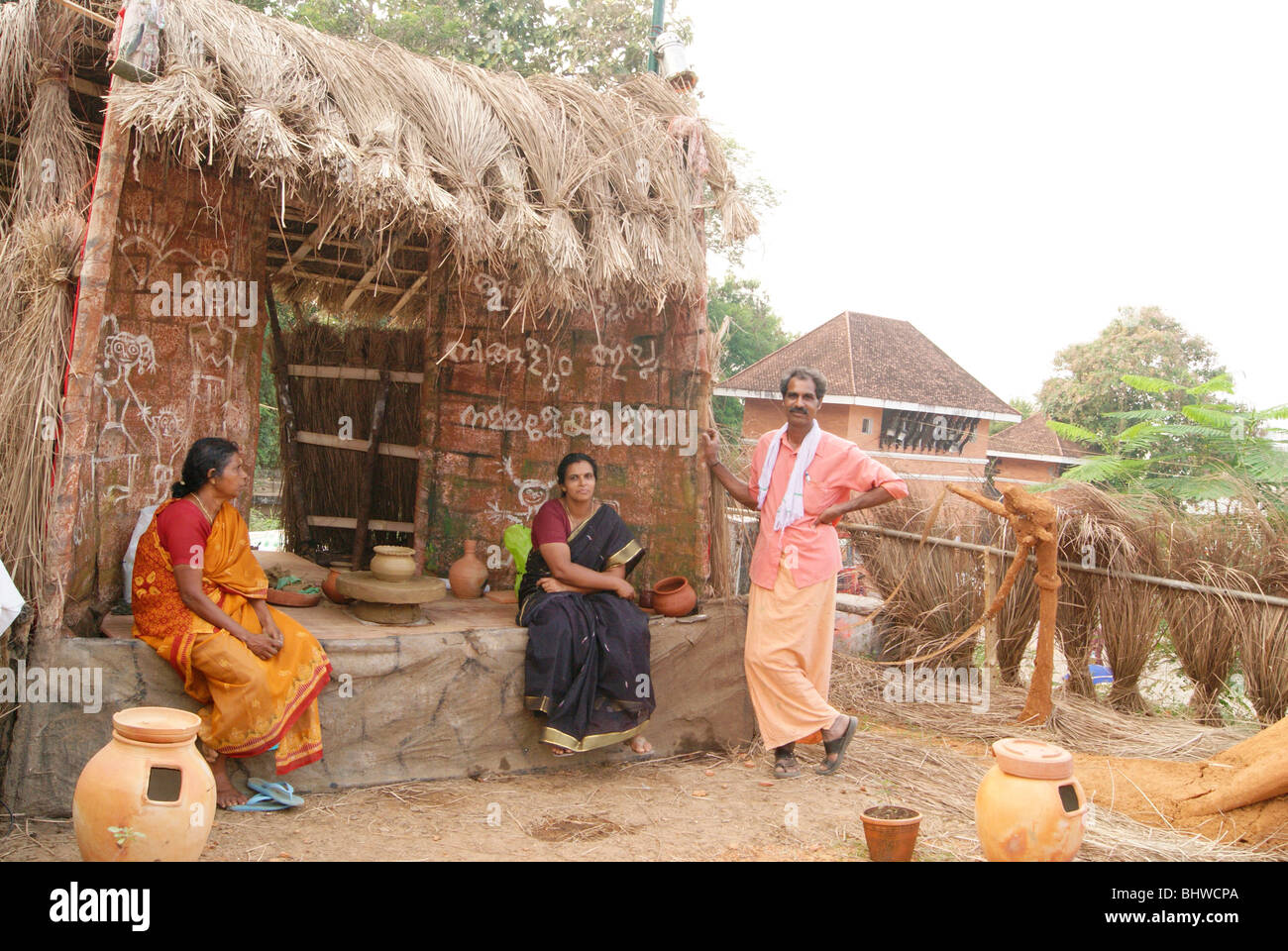 Tribal family with their traditional Pot making tools and works in ...