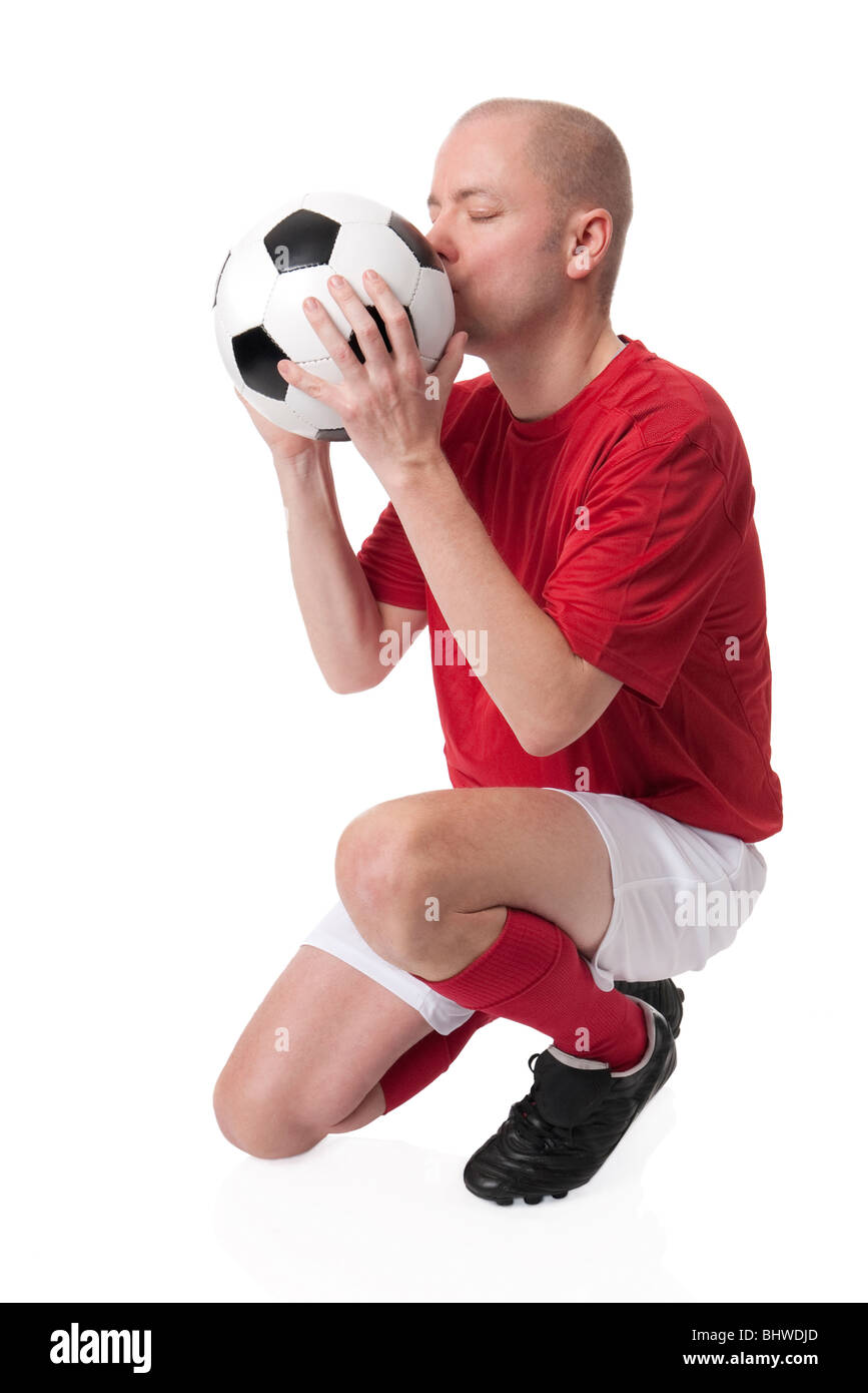 Full isolated studio picture from a young soccer player with ball Stock ...