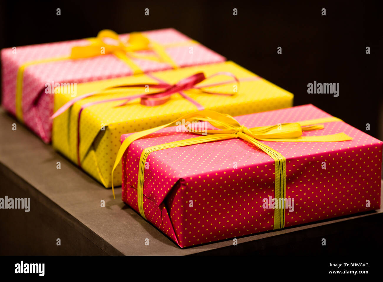 Three presents on a table Stock Photo - Alamy