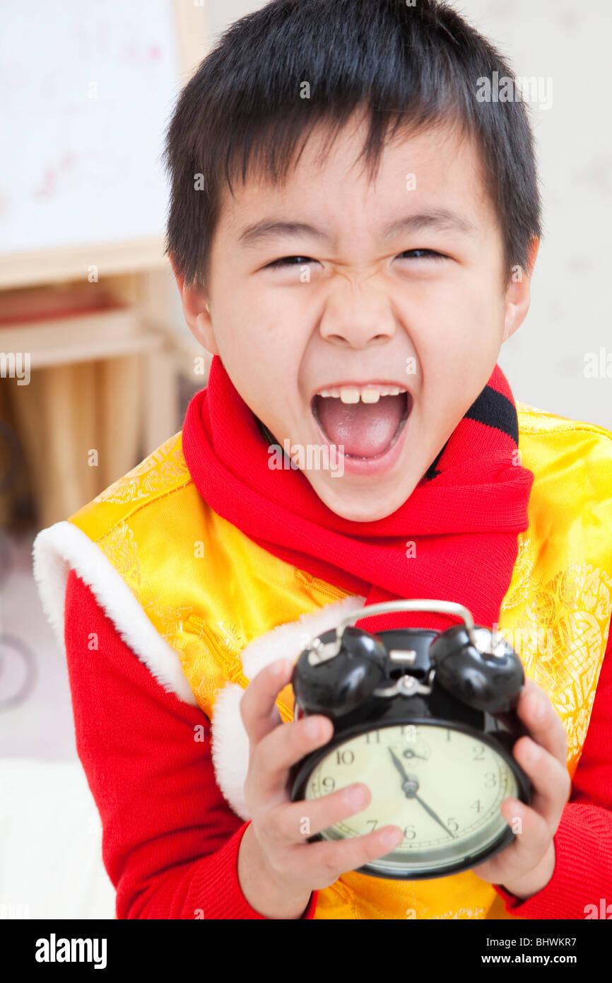 Little boy with clock asian hi-res stock photography and images - Alamy