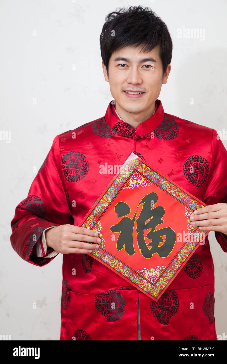 Young man celebrating festival Stock Photo - Alamy