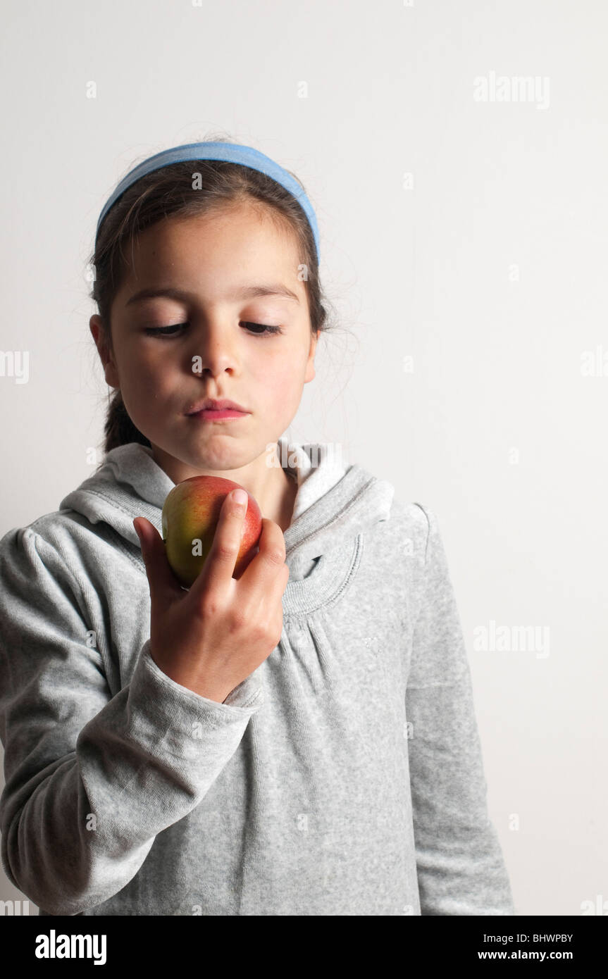 Girl eating an apple Stock Photo - Alamy