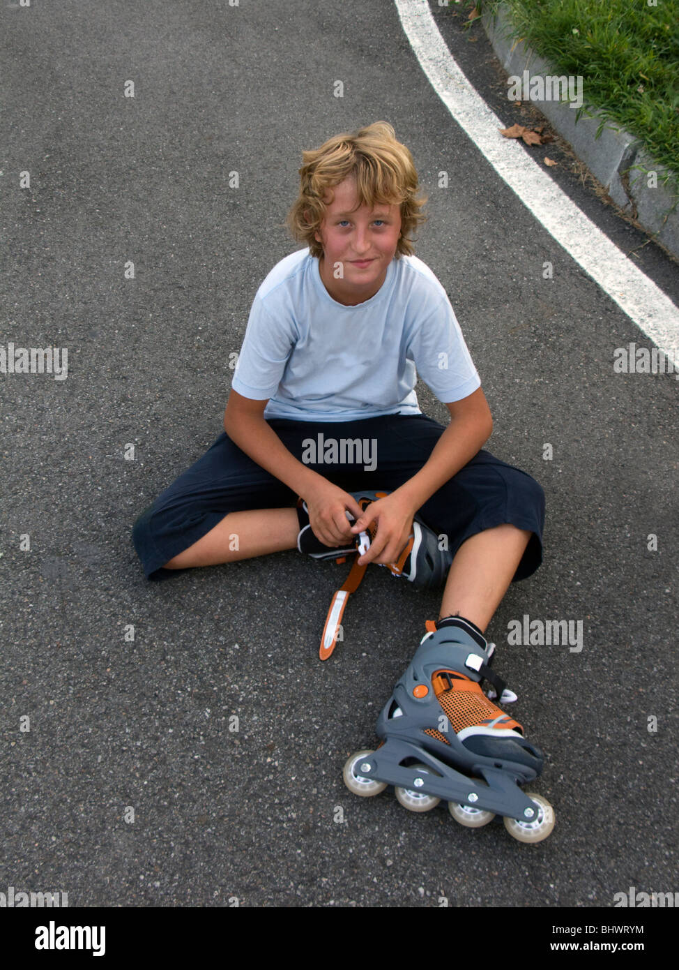 Boy with inline skates Stock Photo - Alamy