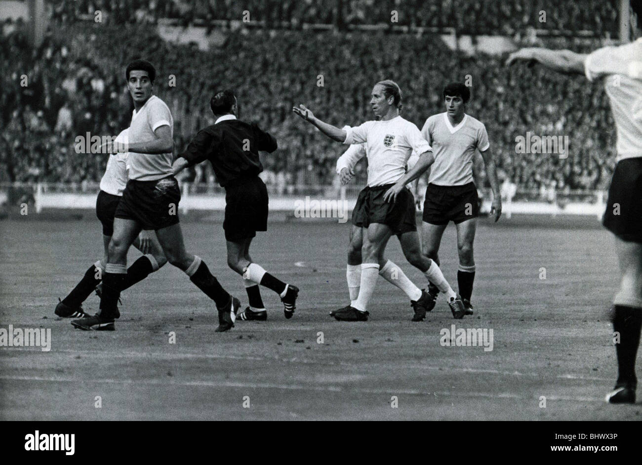1960s action players football playing referee pointing gesturing ...