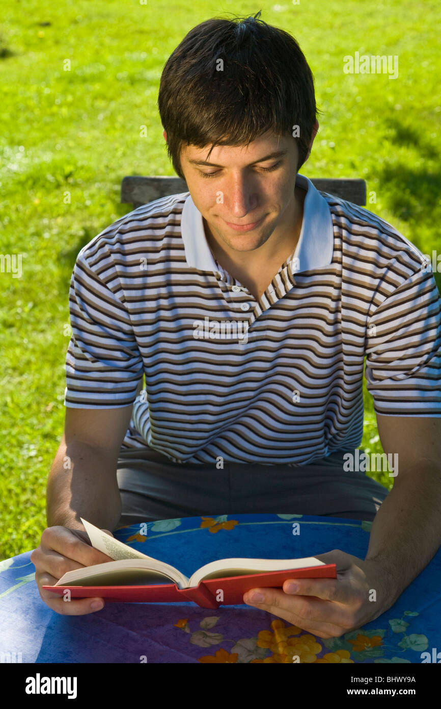 Man reading relaxed book hi-res stock photography and images - Alamy