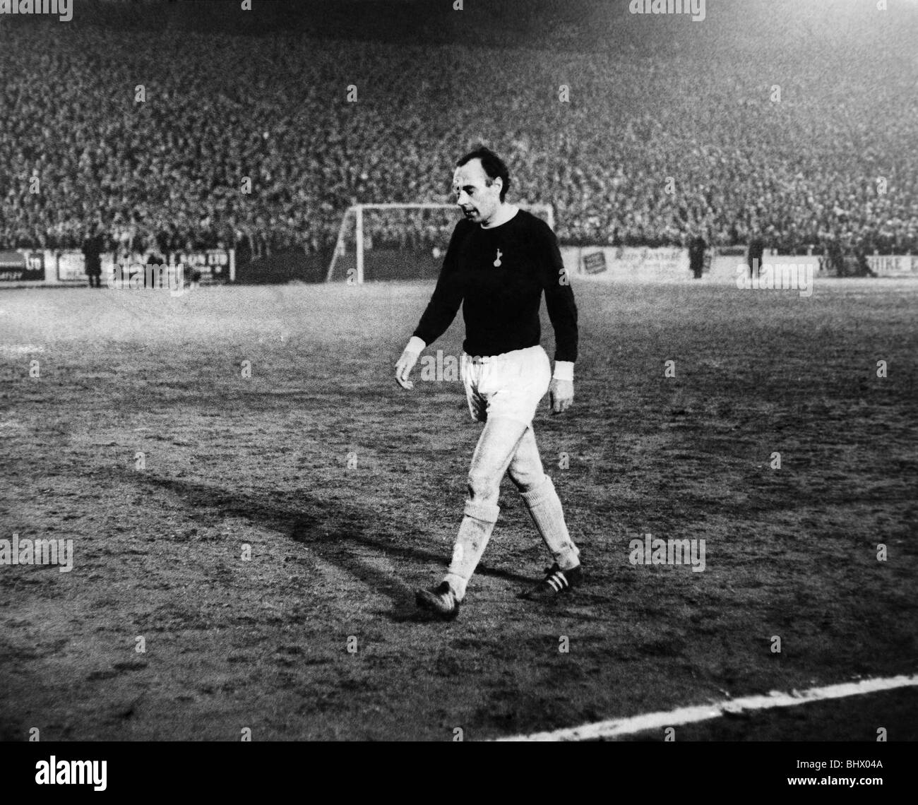 Spurs Scotish international, Alan Gilzean, leaves the pitch after being ...
