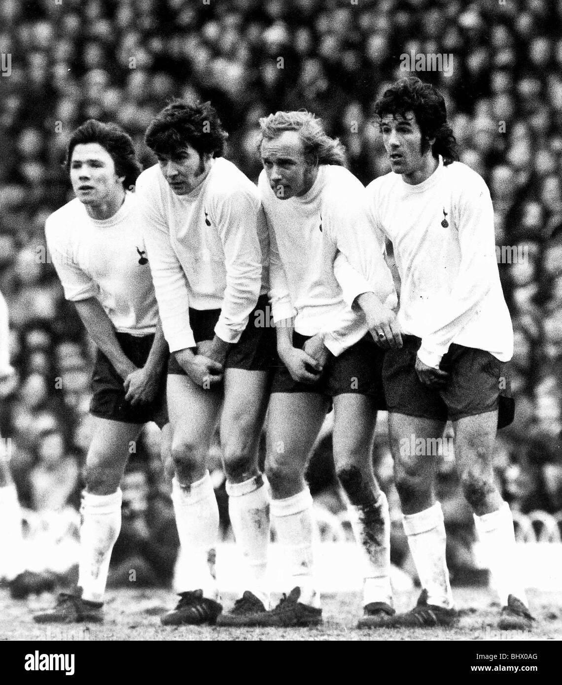Spurs players line up in a wall to defend a free kick during a league ...