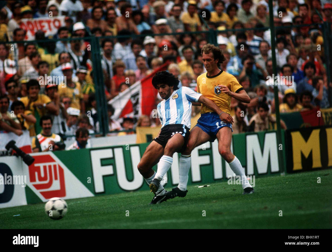Argentina v Brazil World Cup 1982 football Maradona holds off a ...
