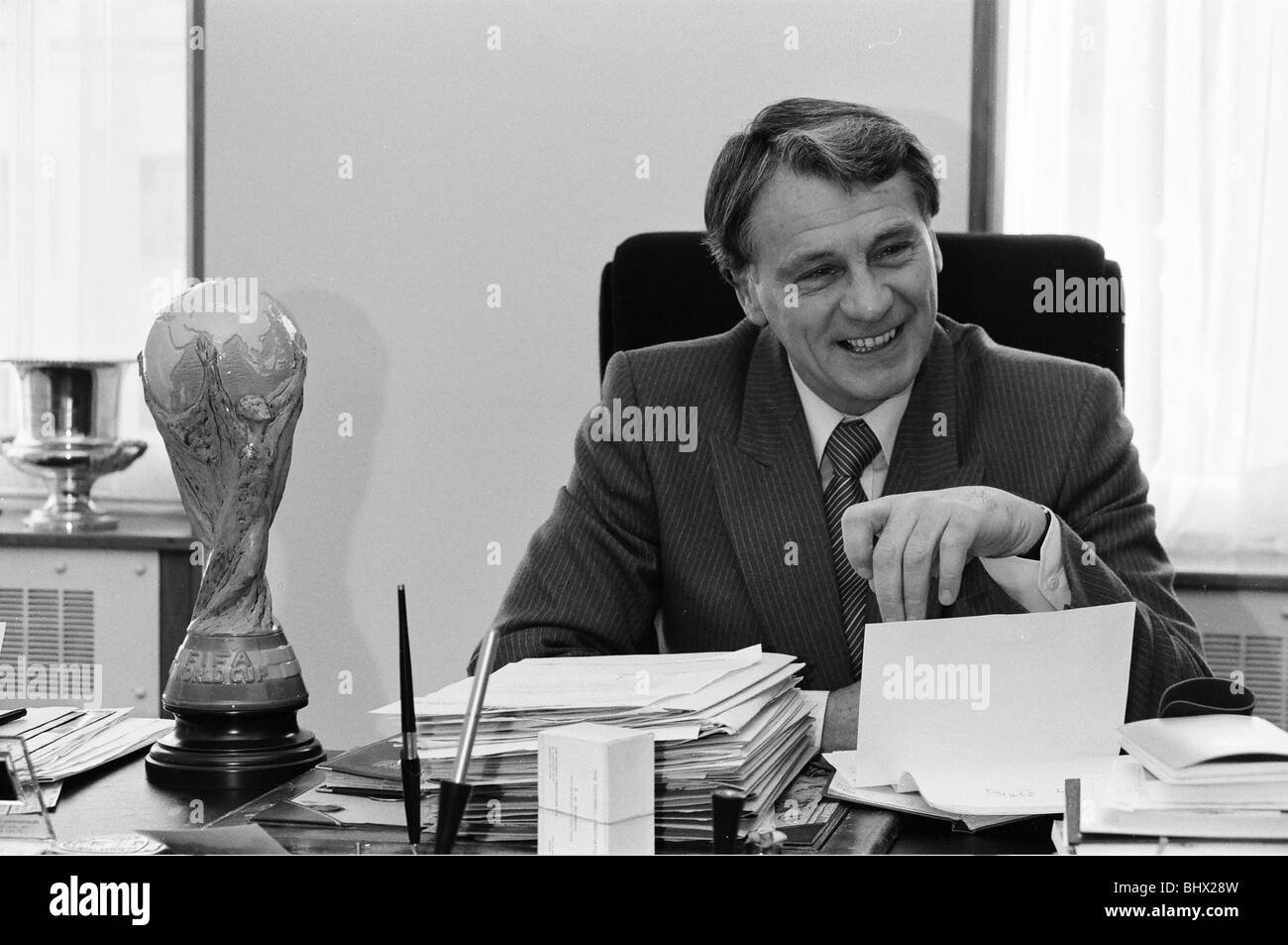 Manager 1980s suit tie trophy replica office busy paperwork Black and ...