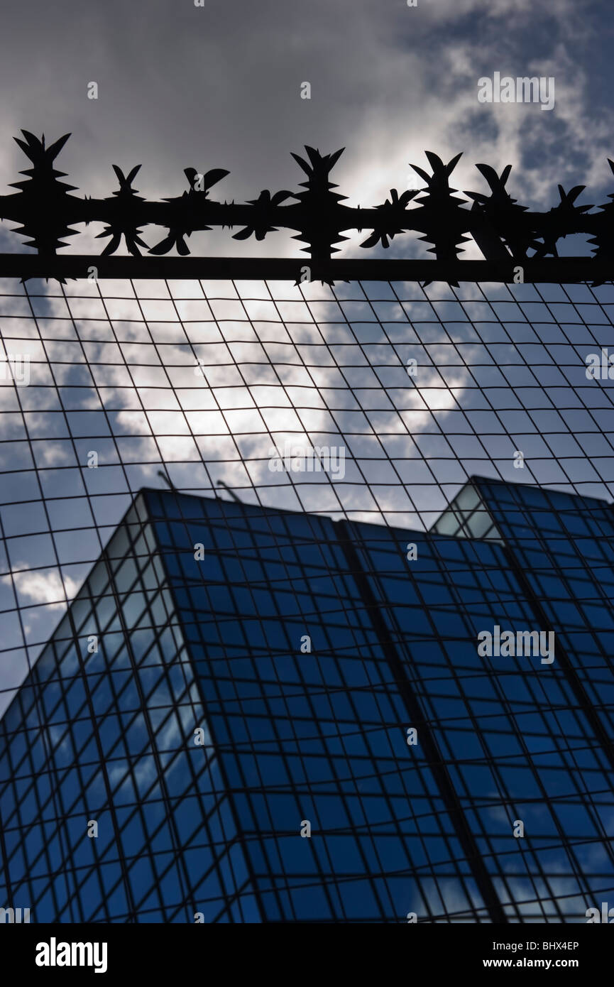 security razor wire perimeter guarding a modern glass building in ...