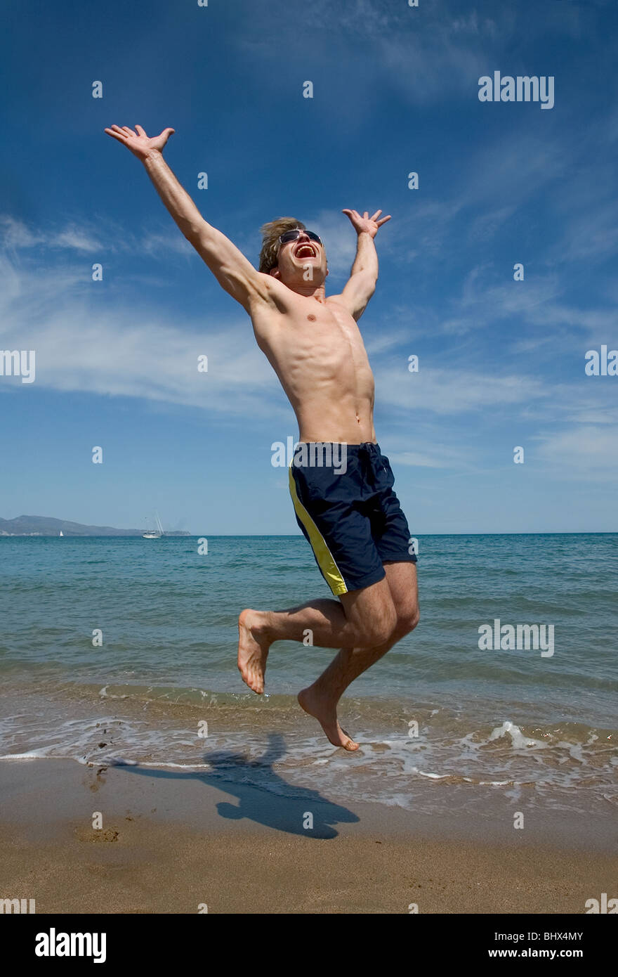 Leaping male athlete hi-res stock photography and images - Alamy