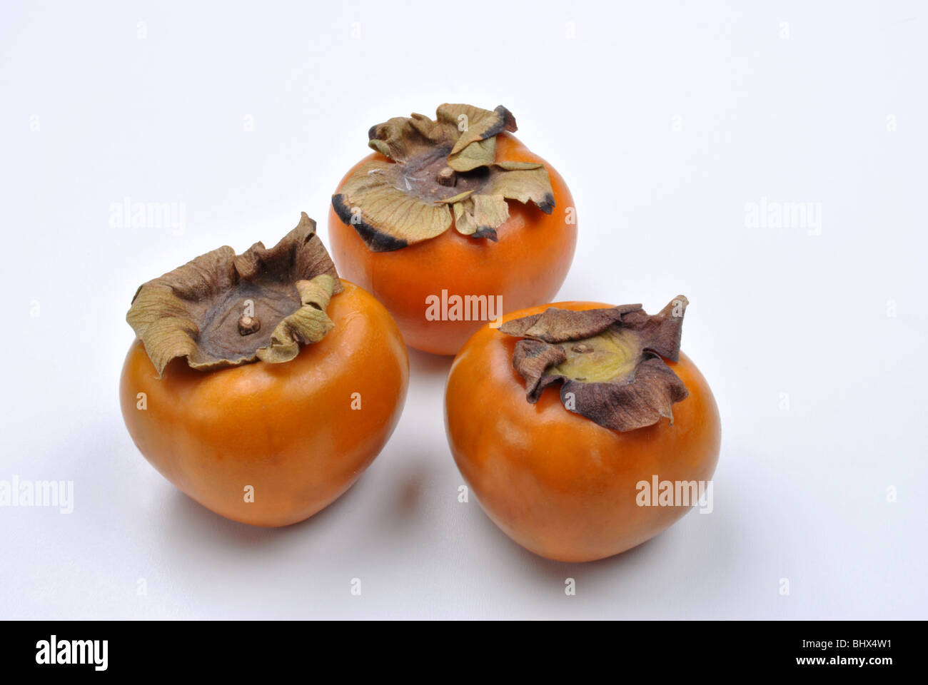 organic sharon fruit and a bright background Stock Photo - Alamy
