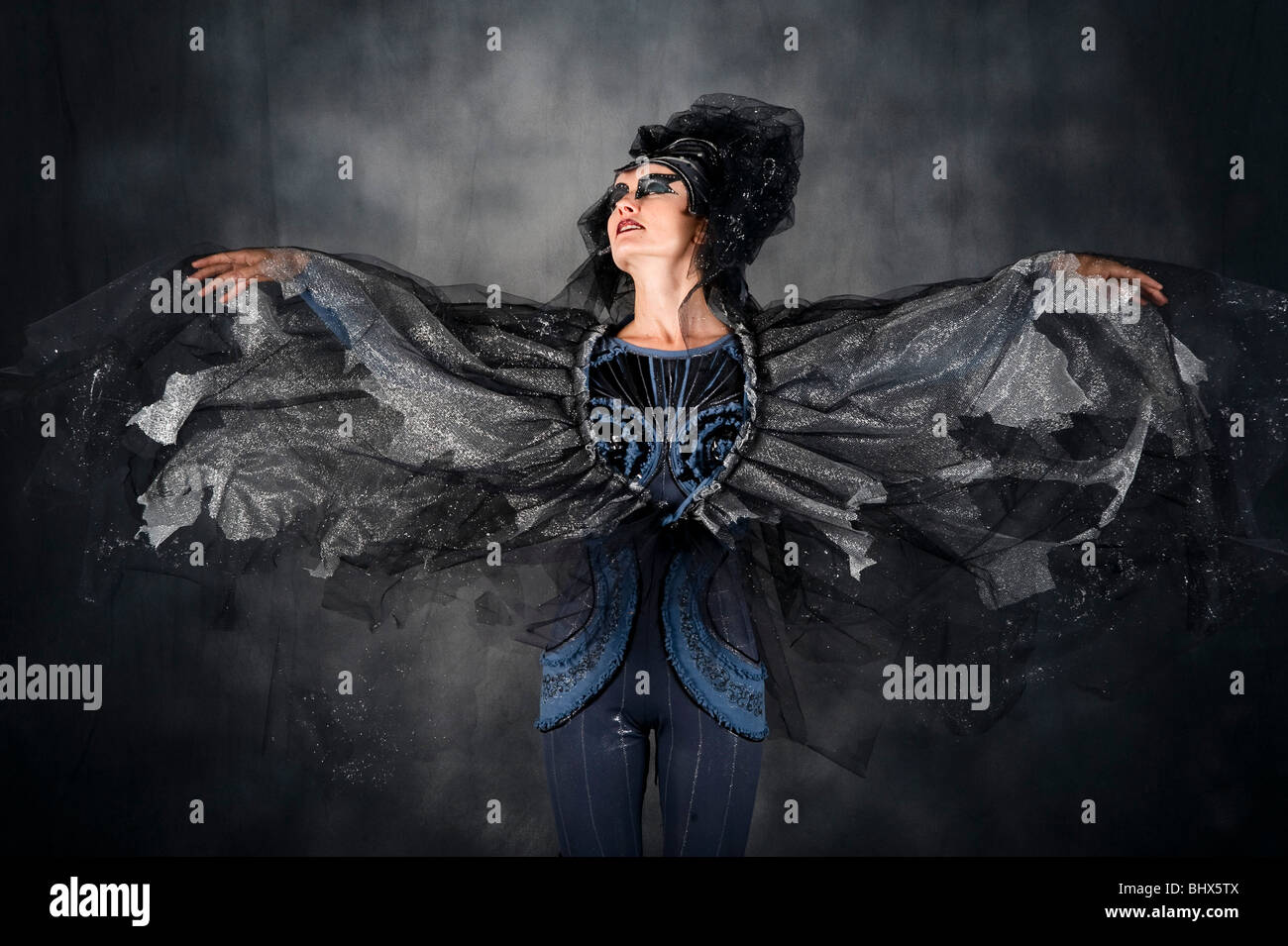 Bat Woman - female actress in her 20s with make up and a bat costume ...