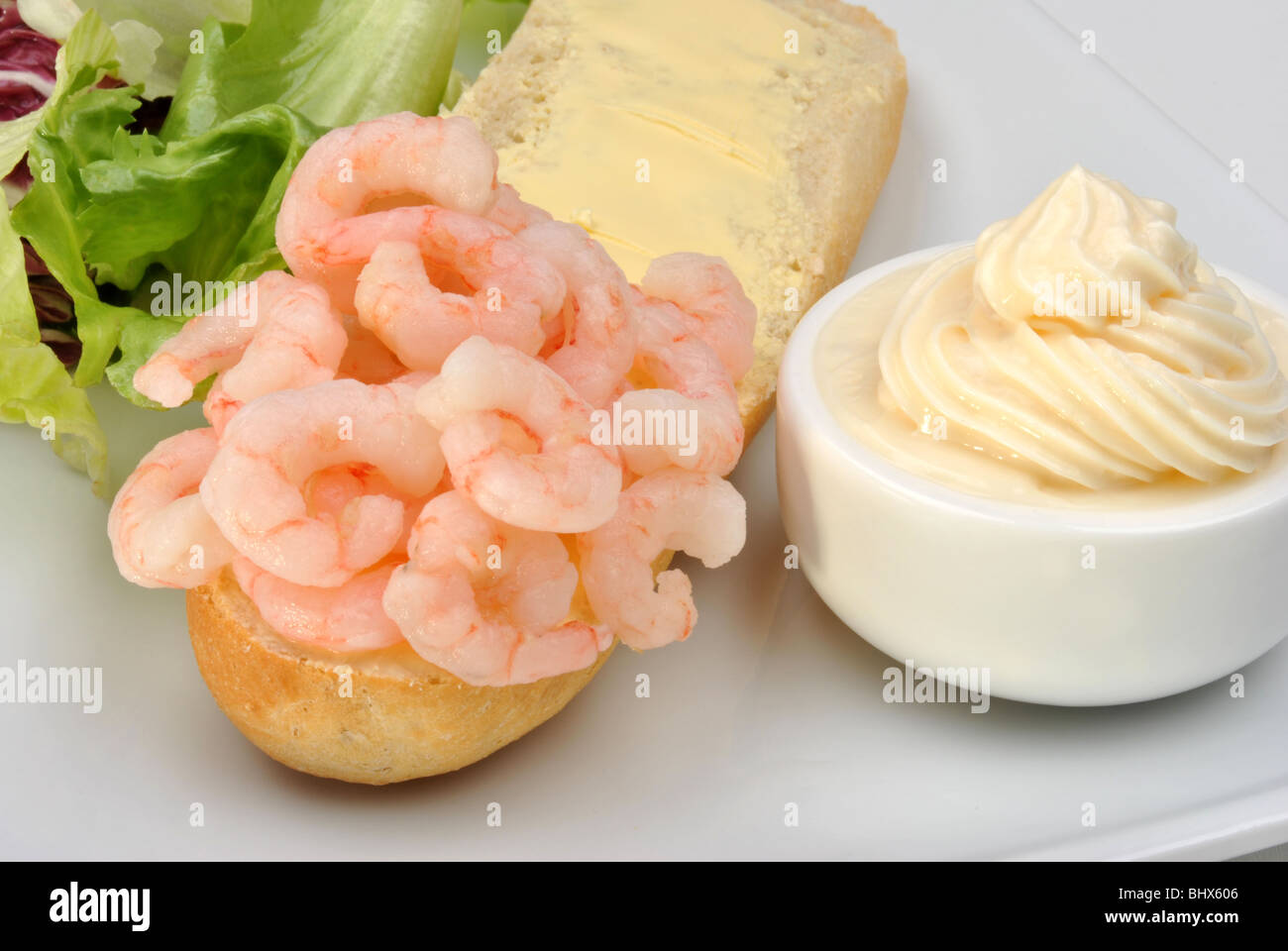 some fresh king prawns on bread roll Stock Photo - Alamy