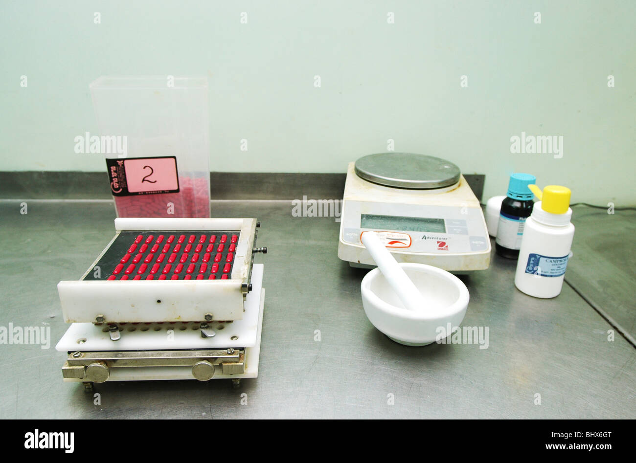 Pharmacist's instruments scale, pestle and mortar and capsule ...