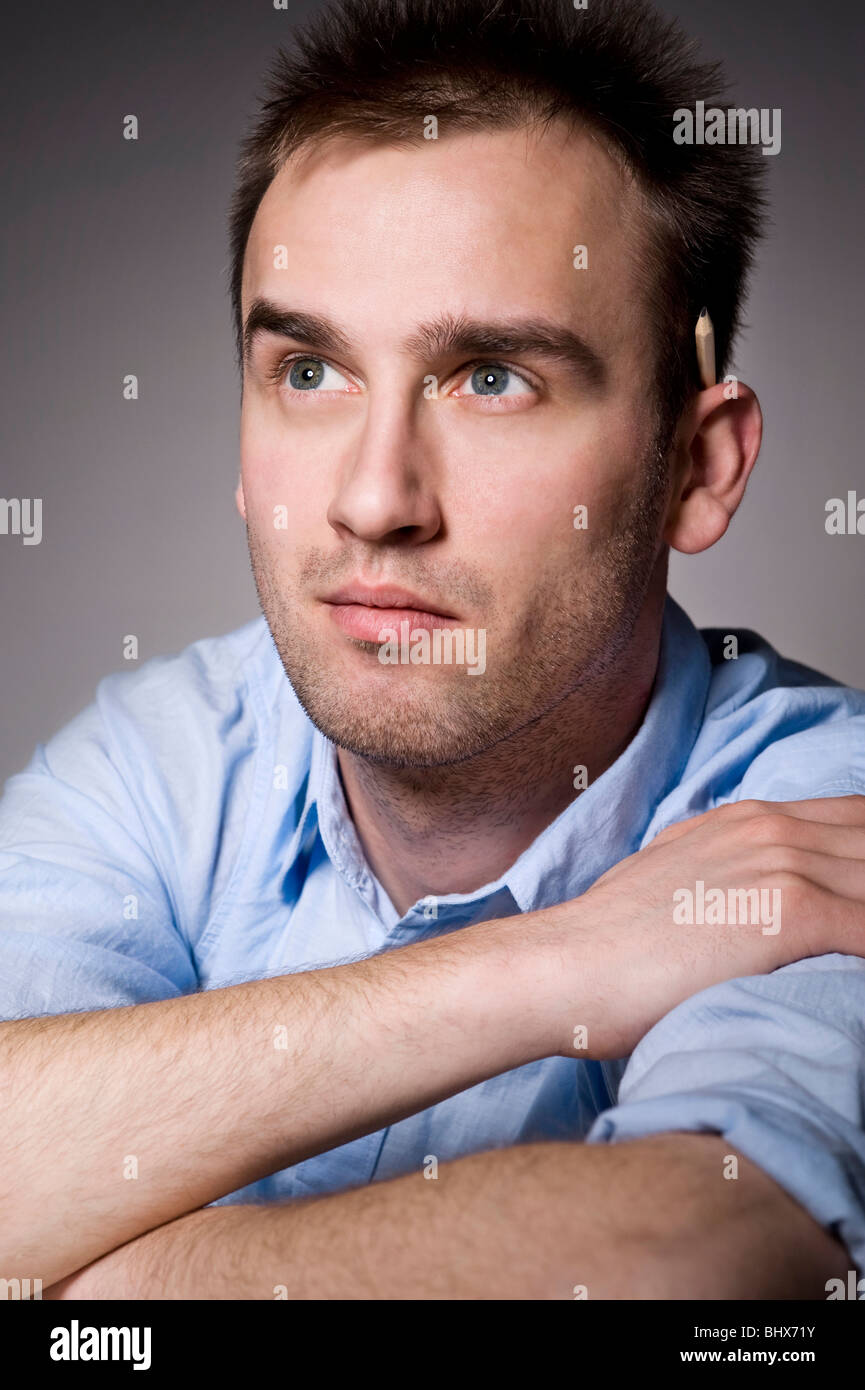 portrait of male engineer with pencil behind an ear Stock Photo - Alamy