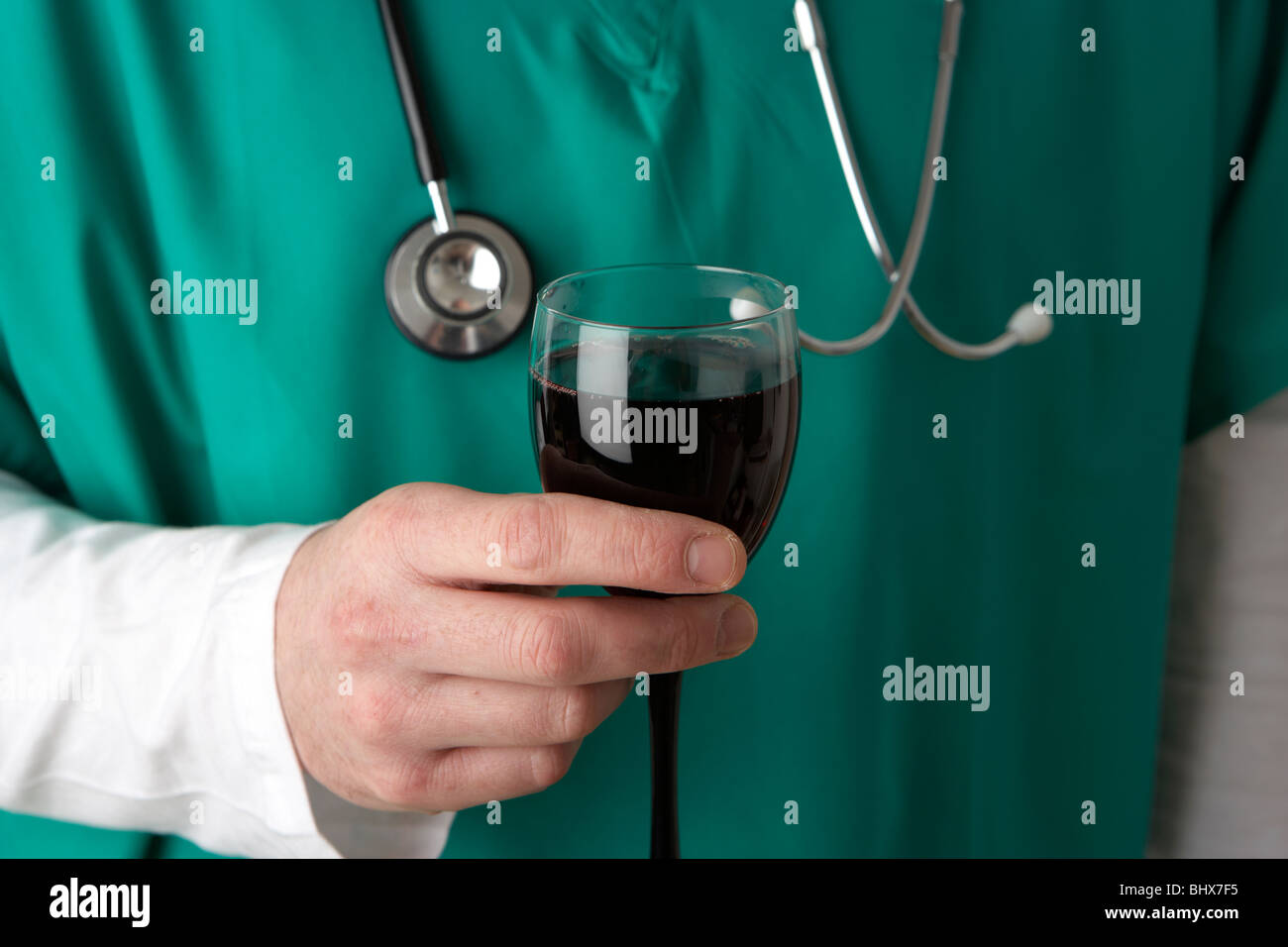 man doctor or nurse wearing medical scrubs and stethoscope holding ...
