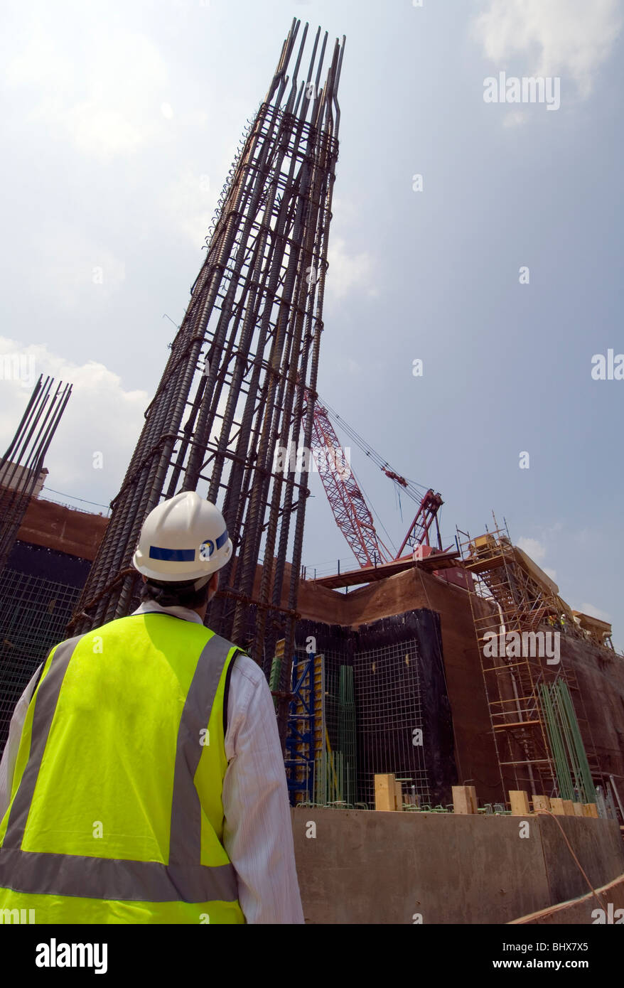 worker inspecting steel form tower Stock Photo - Alamy