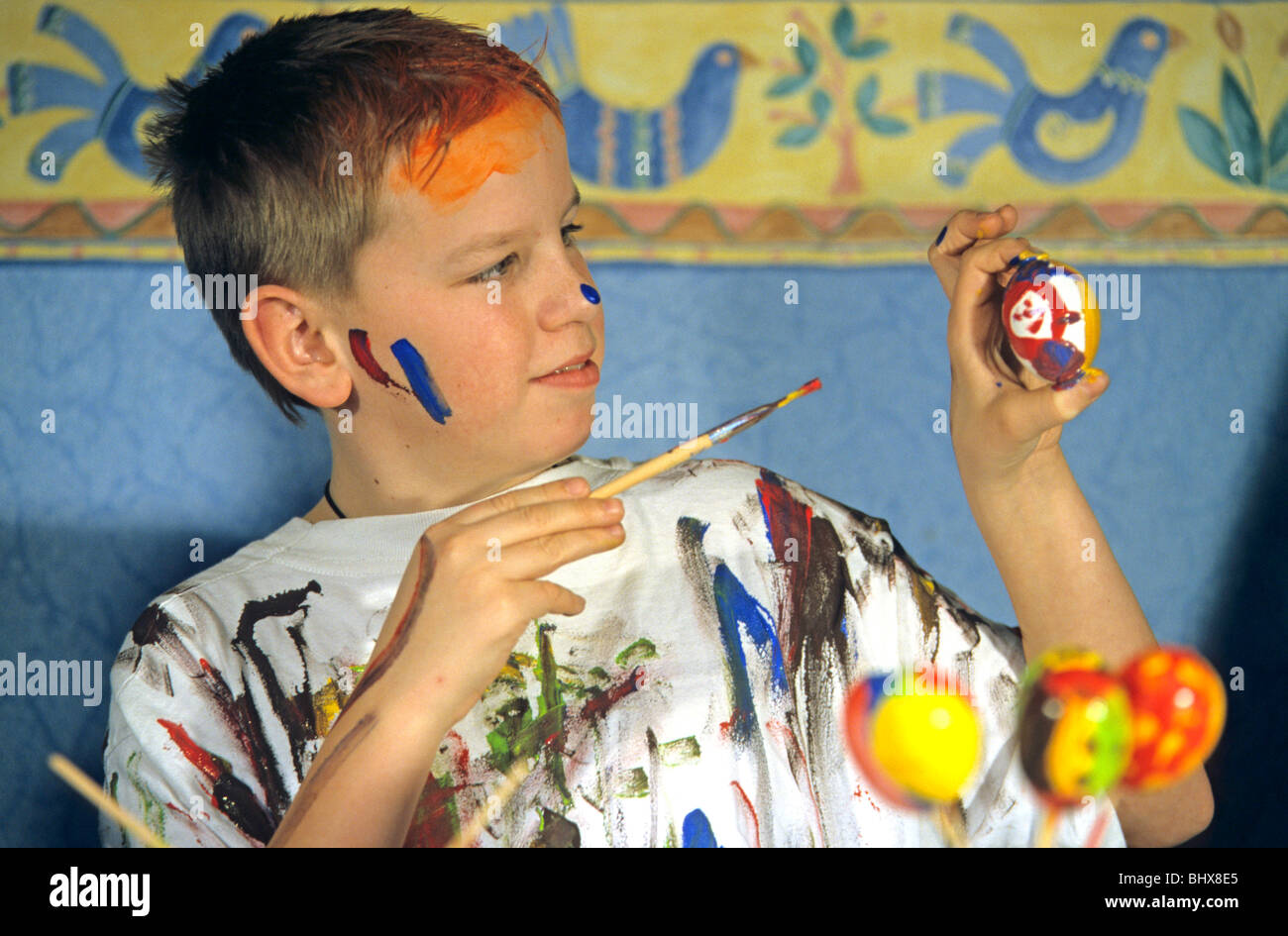 young boy coloring Easter Eggs Stock Photo - Alamy