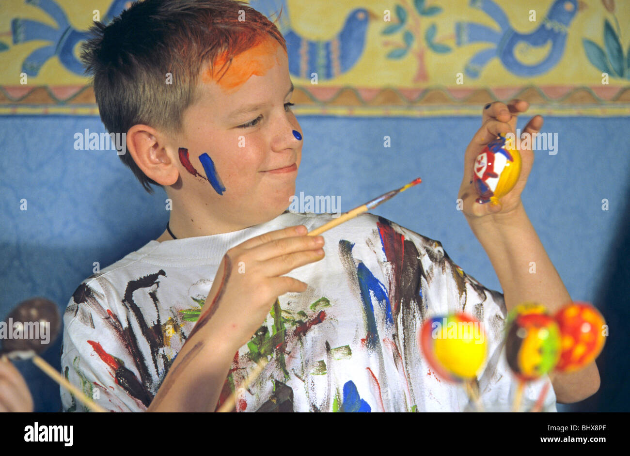 young boy coloring Easter Eggs Stock Photo - Alamy
