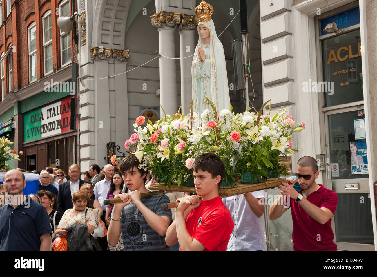 Young men carry statue on their shoulders in Procession in Honour of ...