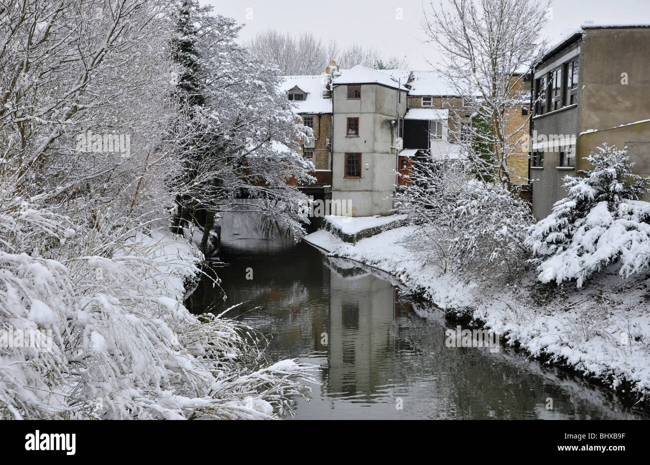 Snow scene, back of buildings on bridge over the river Frome in Frome ...