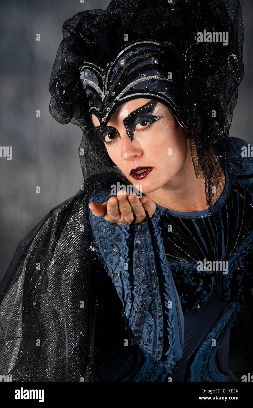 Bat Woman - female actress in her 20s with make up and a bat costume ...