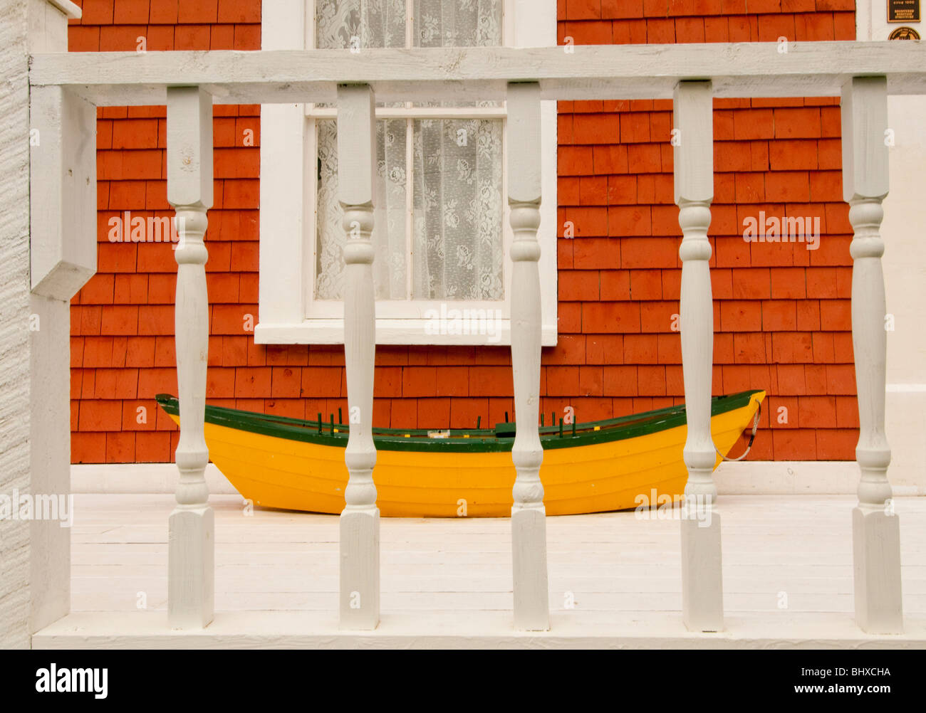NEWFOUNDLAND, Fishing village of WOODY POINT, Colorful Yellow Dory boat ...