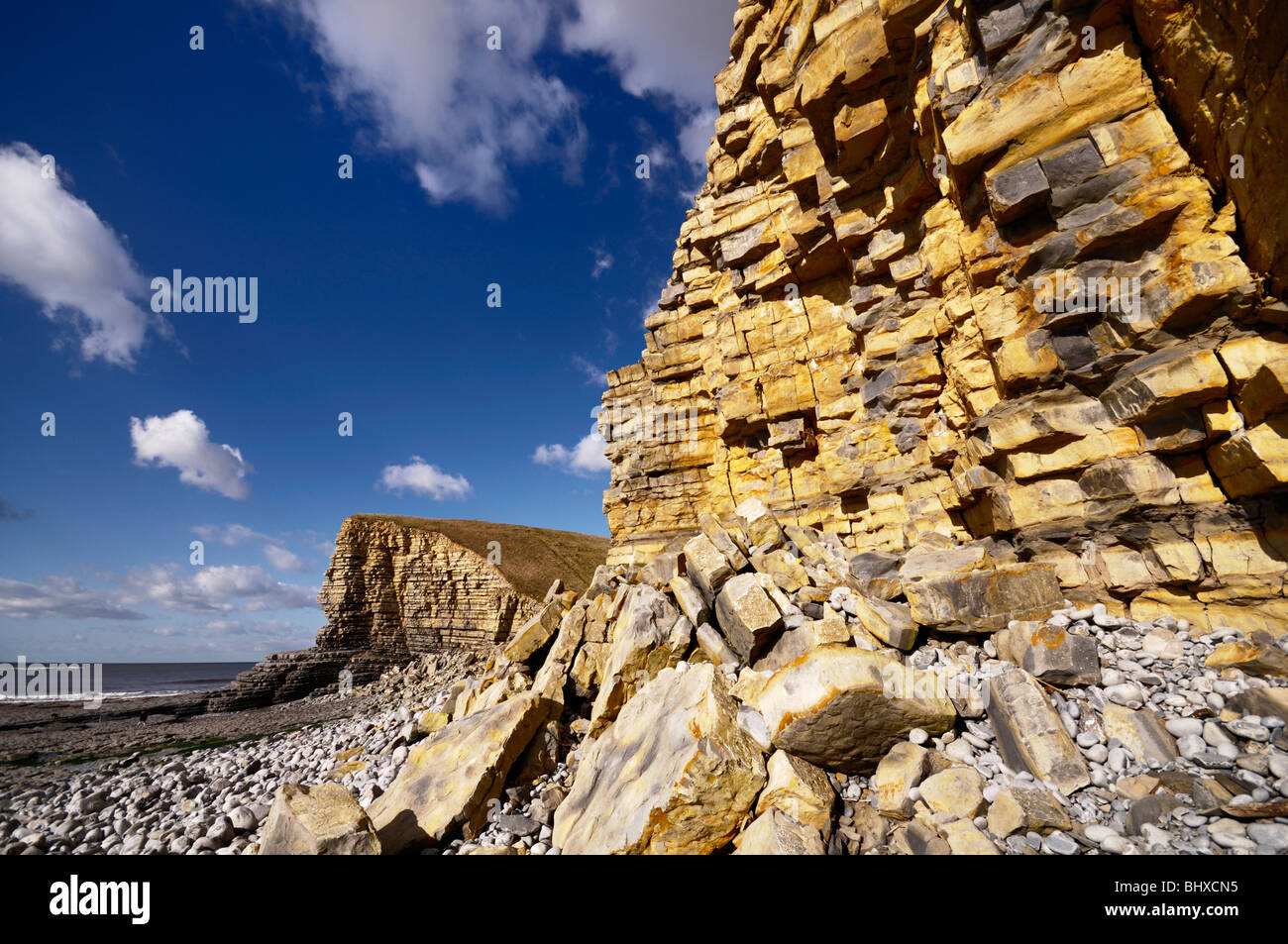 Cliffs at Nash point in South Wales viewed from the rocky Limestone and ...