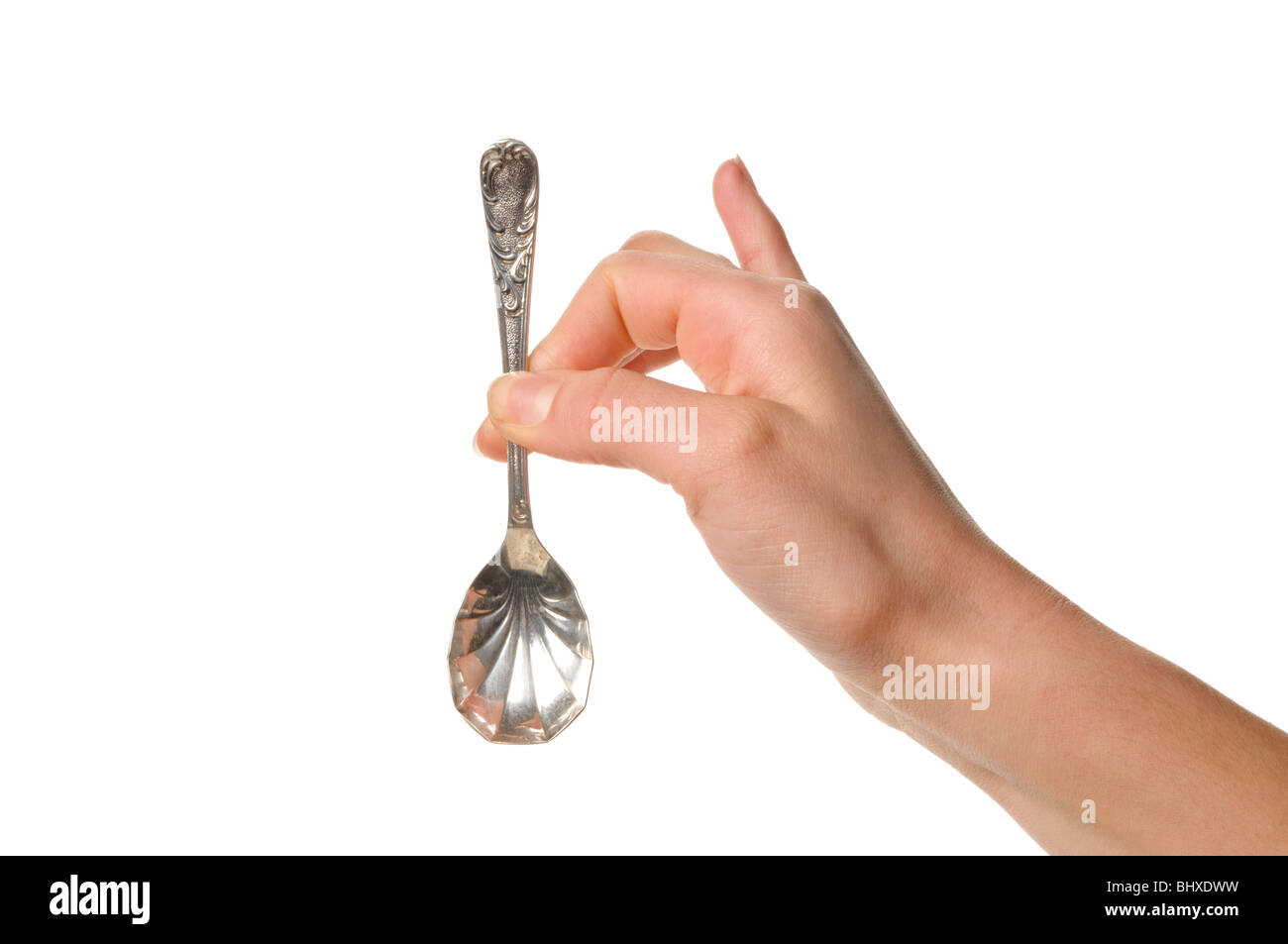 hand holding silver spoon Stock Photo - Alamy