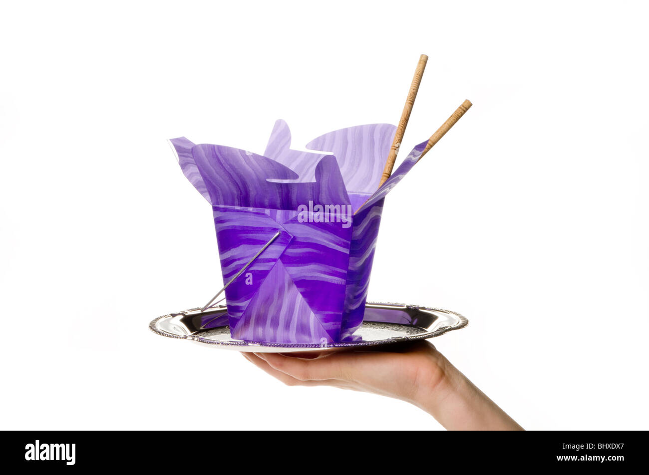 Asian hand holding object Cut Out Stock Images & Pictures - Alamy