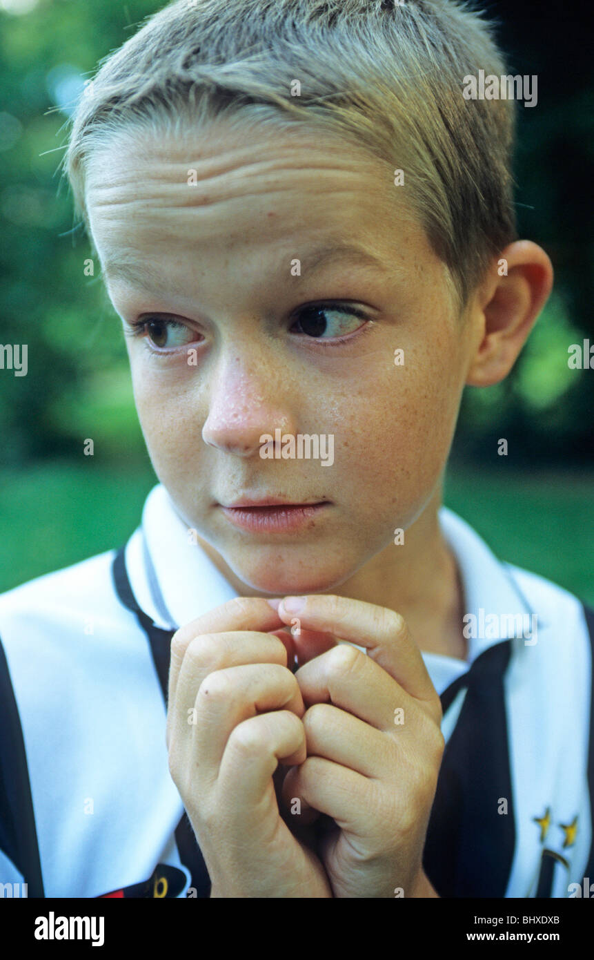 portrait of a scared young boy Stock Photo - Alamy