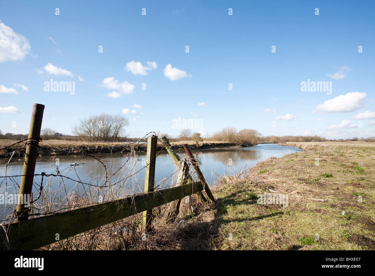 old broken fence by the side of a river Stock Photo - Alamy