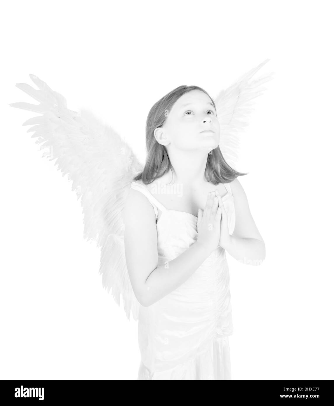 high key little angel fairy girl praying Stock Photo - Alamy