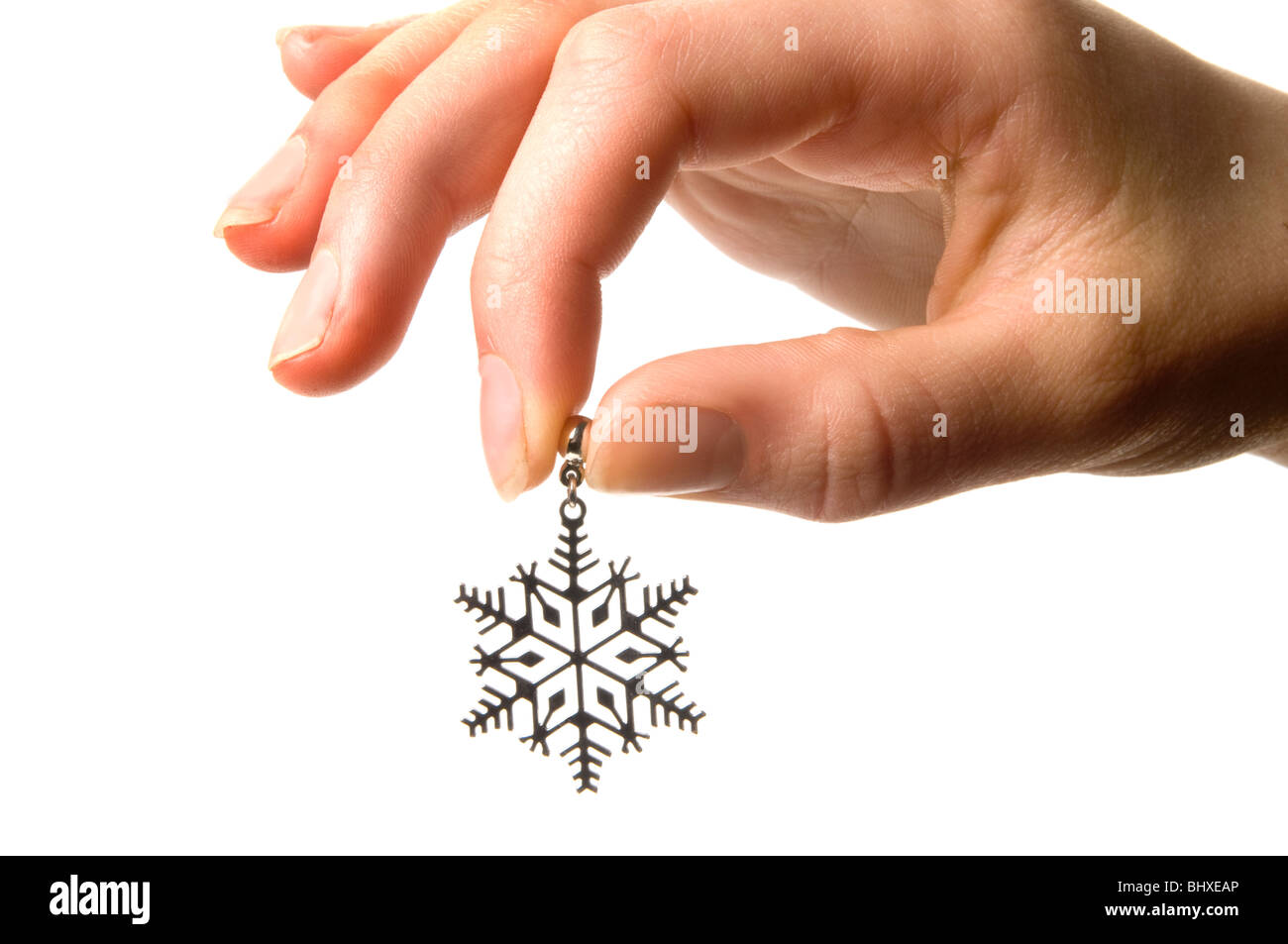 hand holding silver snow flake Stock Photo - Alamy