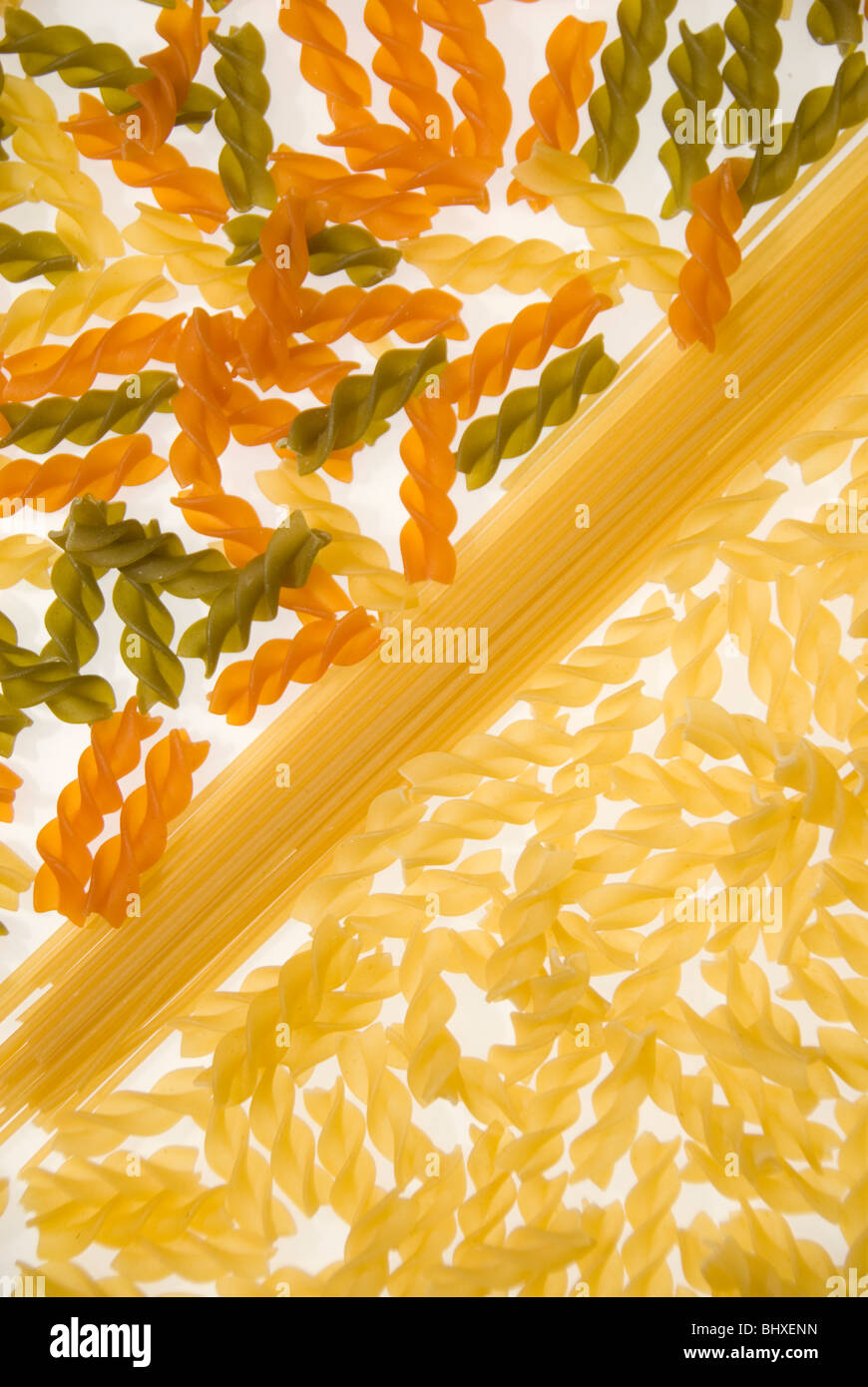 Yellow and Tricolor Fusilli and Spaghetti Pasta Isolated on White ...