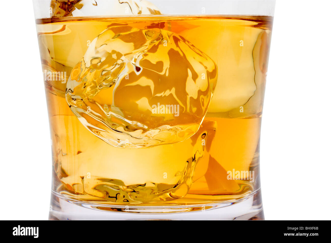 Scotch and water on the rocks on white background Stock Photo - Alamy