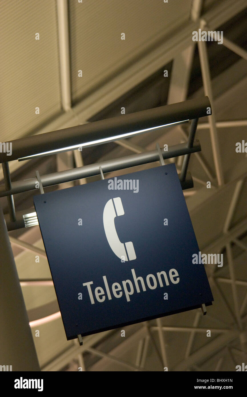 Hanging blue sign Stock Photo - Alamy