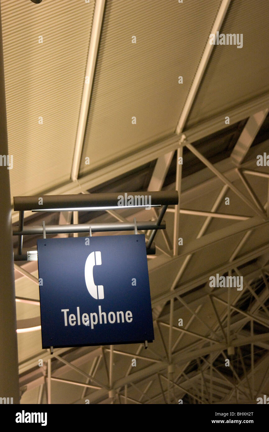 Hanging blue sign Stock Photo - Alamy
