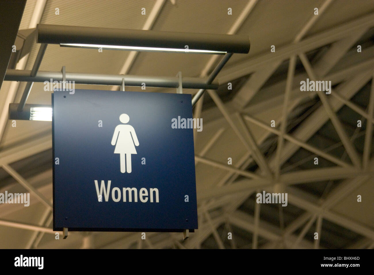 Hanging blue sign Stock Photo - Alamy