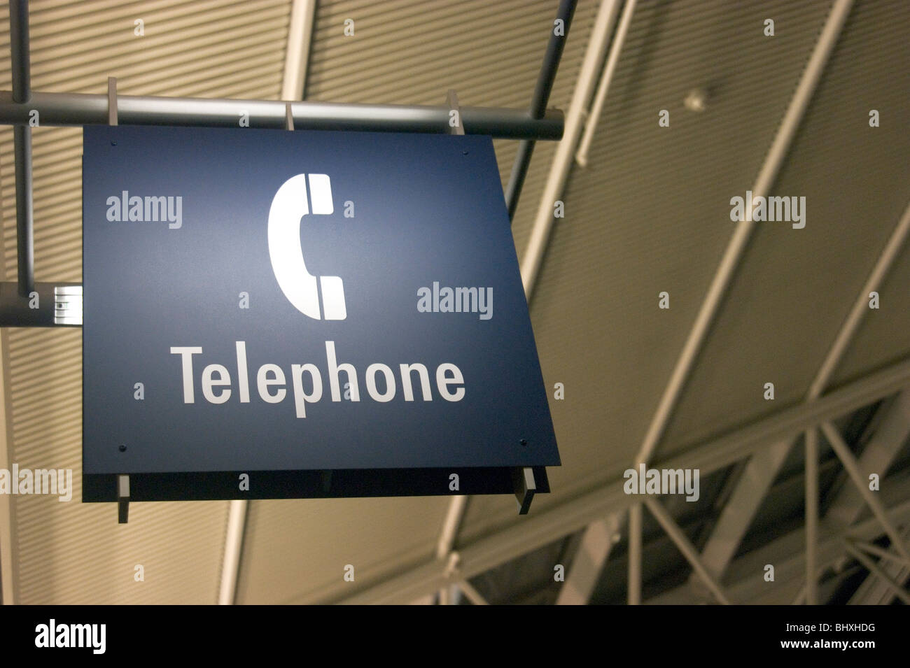 Hanging blue sign Stock Photo - Alamy