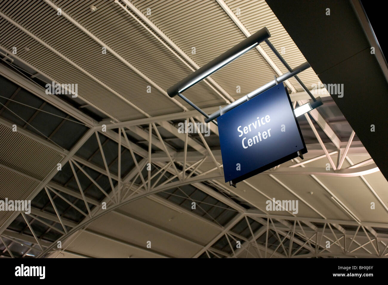 Hanging blue sign Stock Photo - Alamy