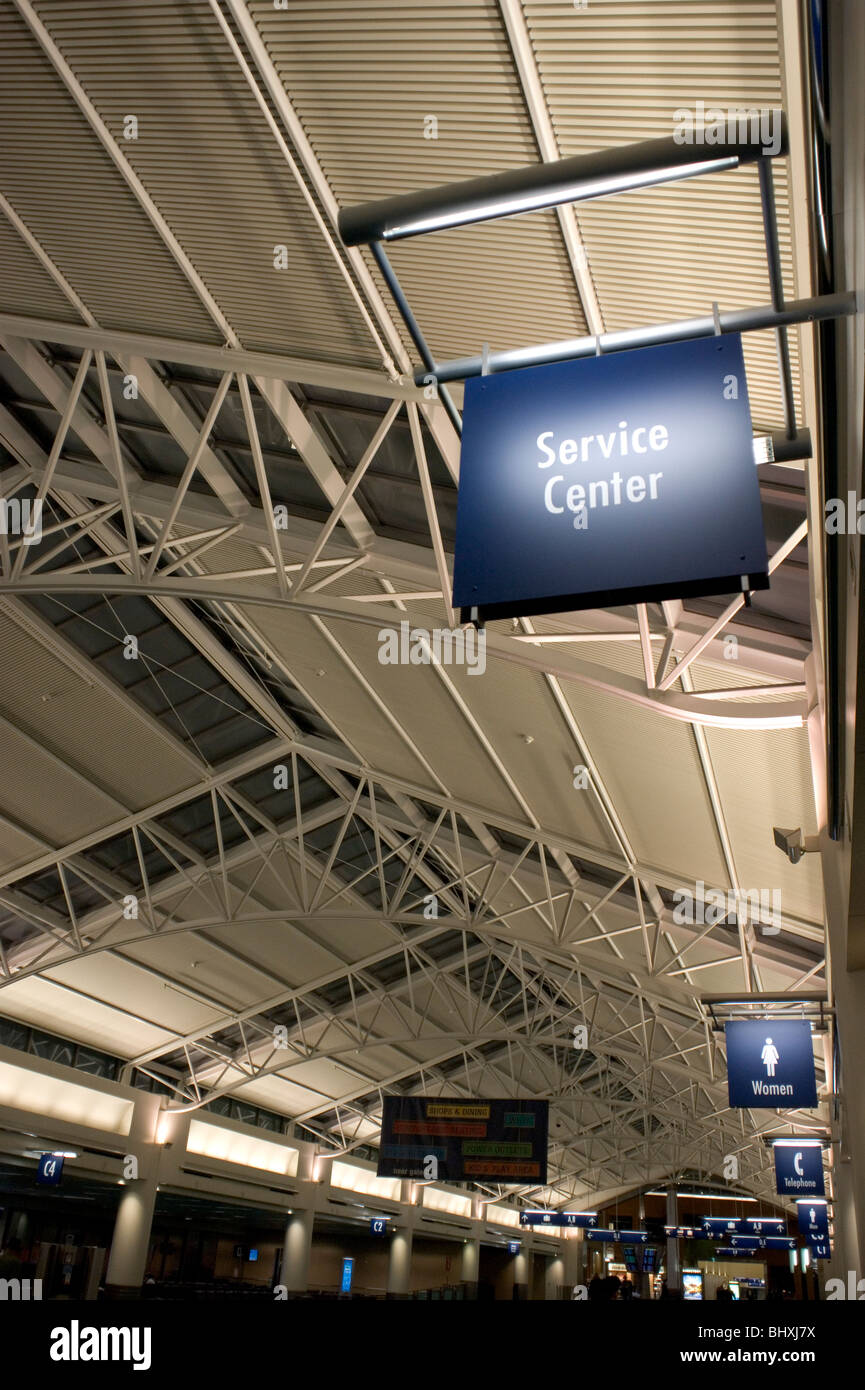 Hanging blue sign Stock Photo - Alamy