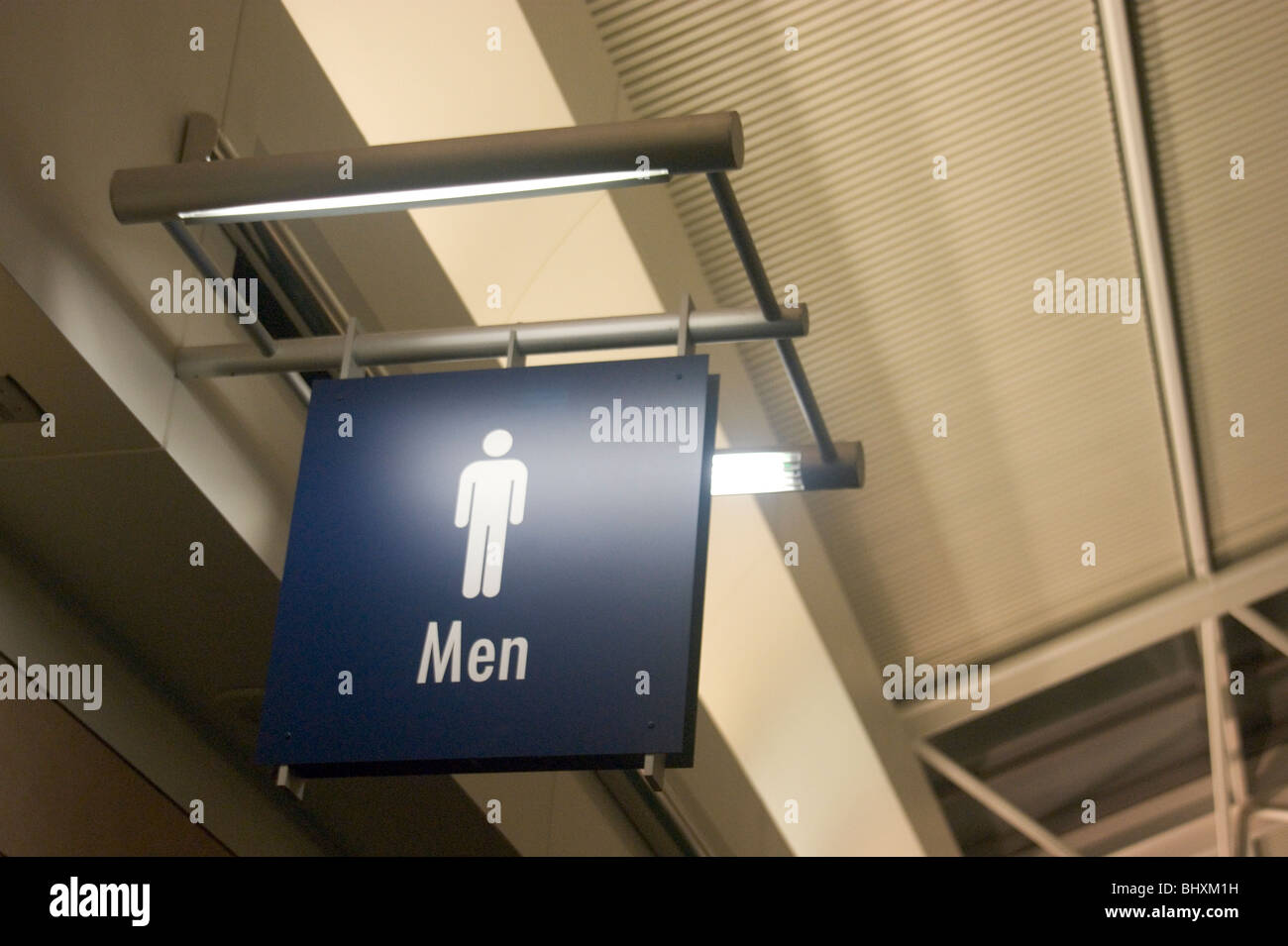 Hanging blue sign Stock Photo - Alamy