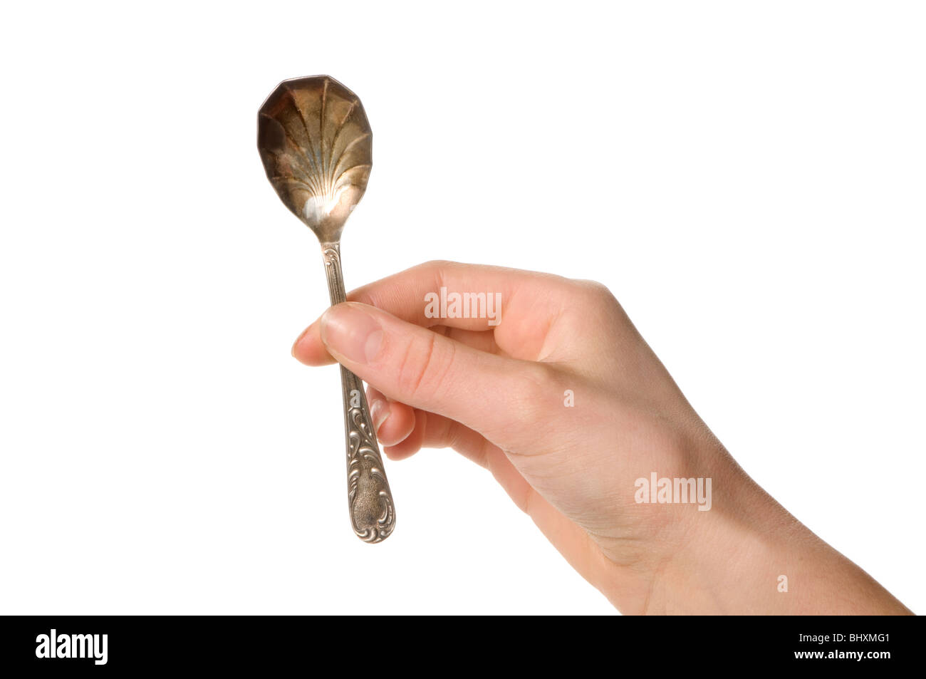 hand holding spoon Stock Photo - Alamy