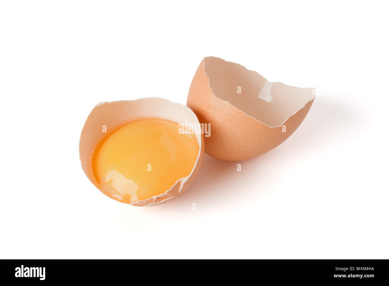 broken egg on white background Stock Photo - Alamy
